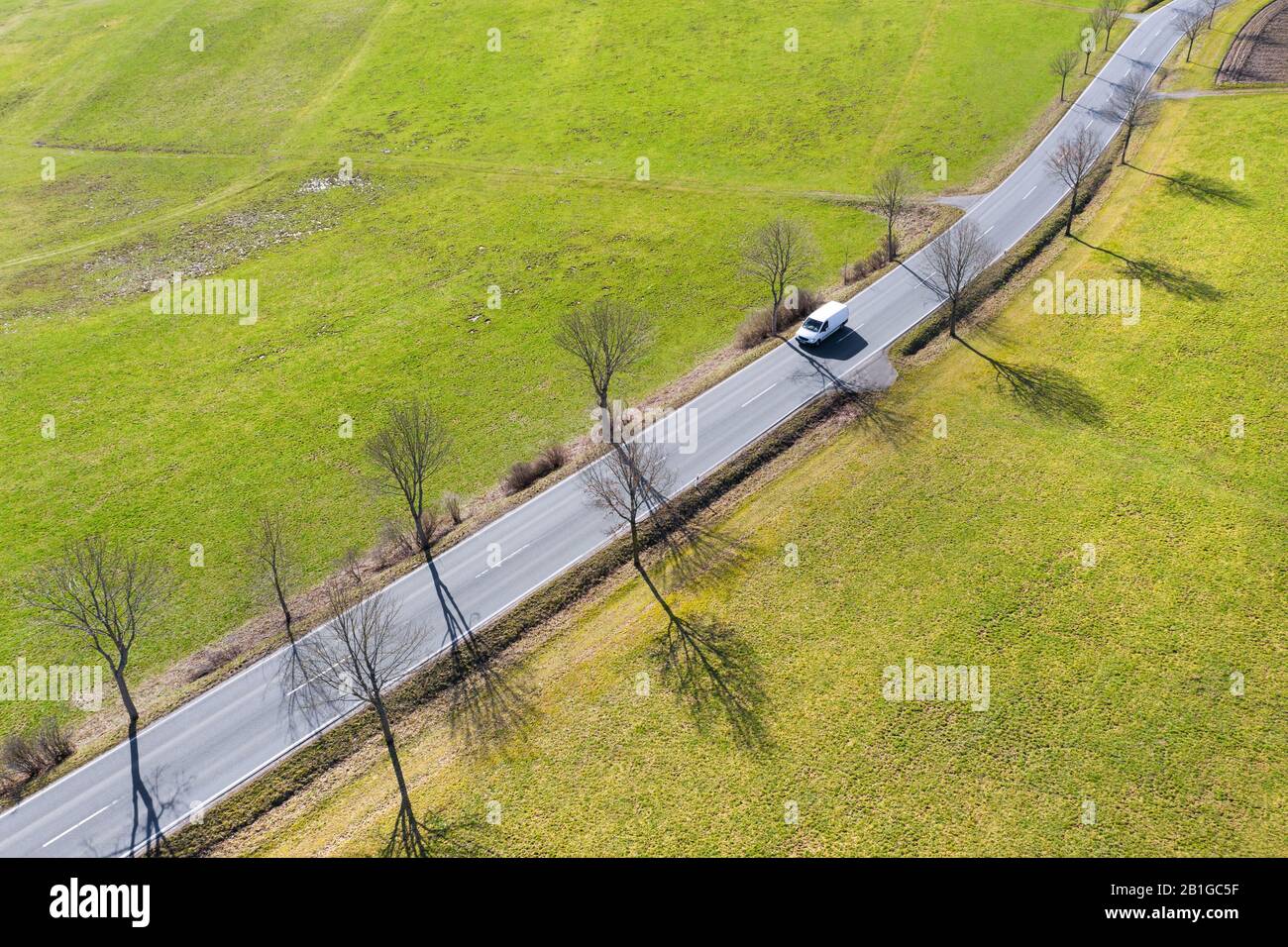 a van on an avenue from above in the sun Stock Photo - Alamy