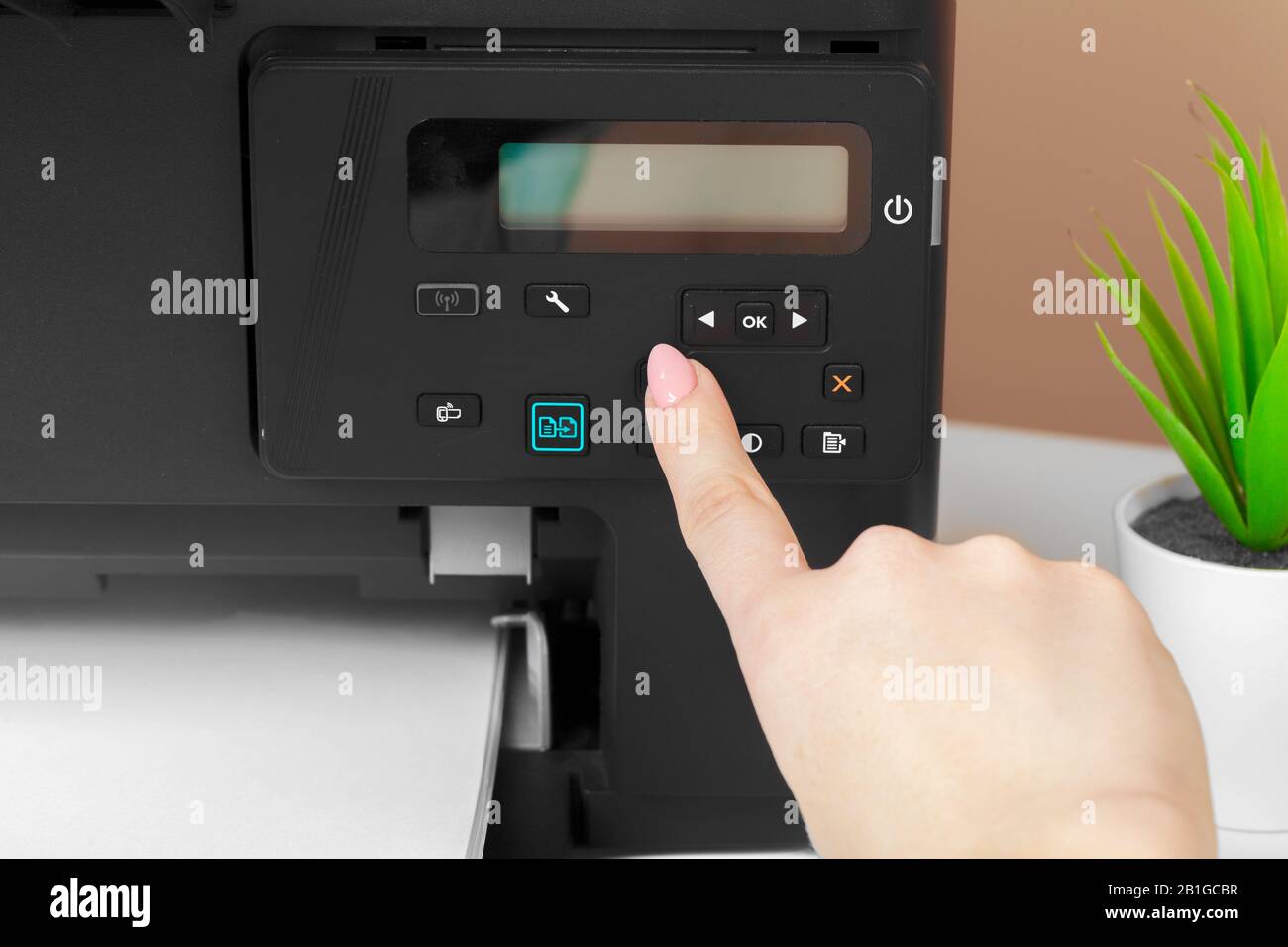 Woman using the printer to scanning and printing document Stock Photo ...
