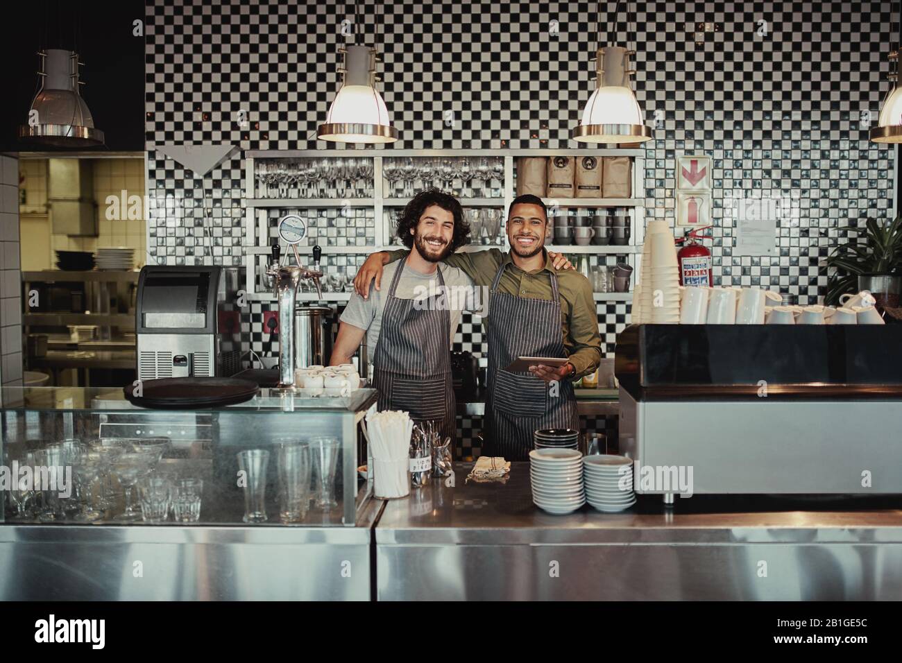 Hand on shoulder behind hi-res stock photography and images - Alamy