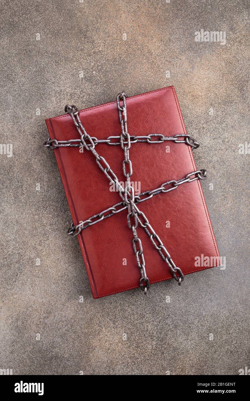 Chained red book above Stock Photo - Alamy