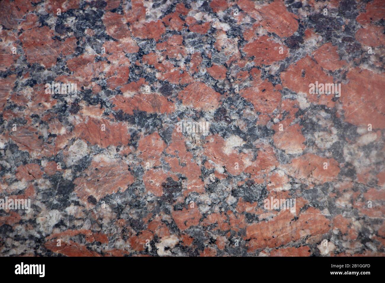Red granite natural polished stone tile texture Stock Photo - Alamy