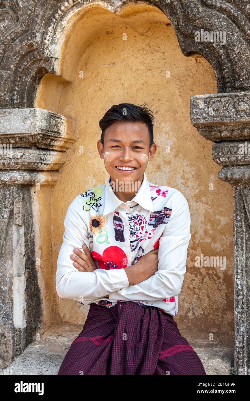 Young Burmese man posing at Shwegugyi Temple, Bagan, Mandalay Region ...