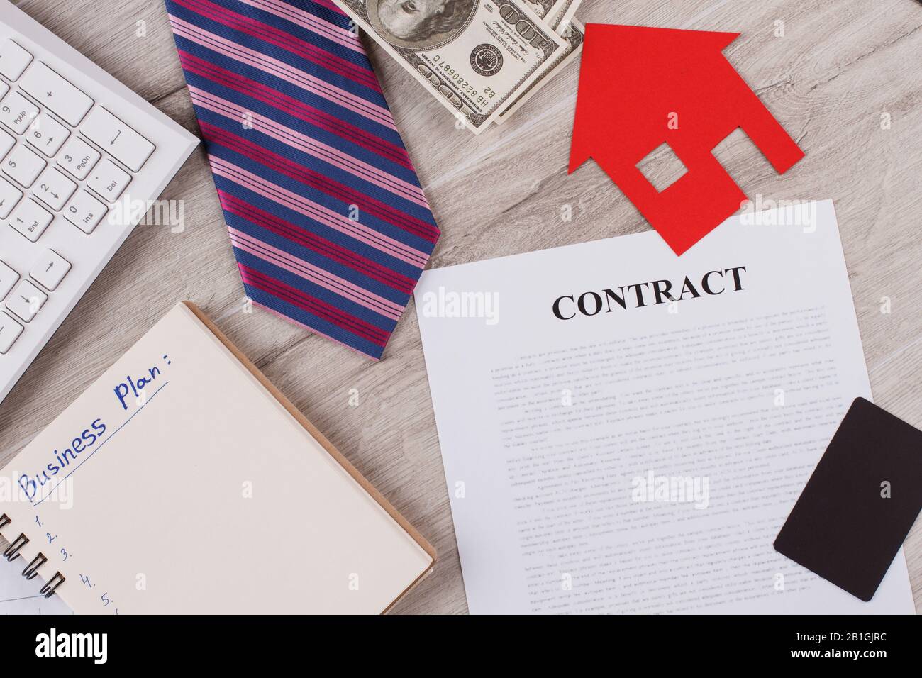 Contract with various items Stock Photo - Alamy