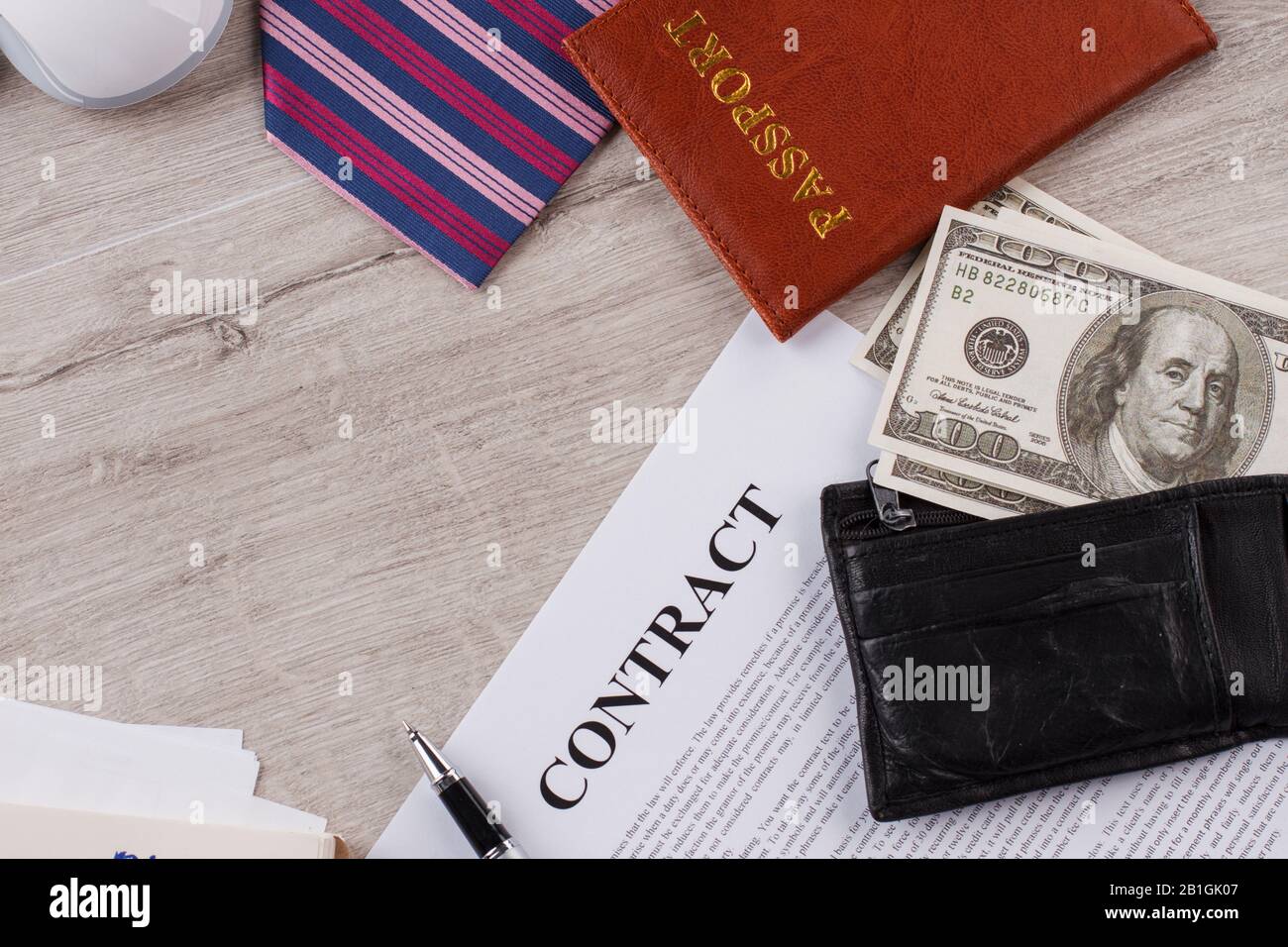 Contract, tie and passport Stock Photo - Alamy