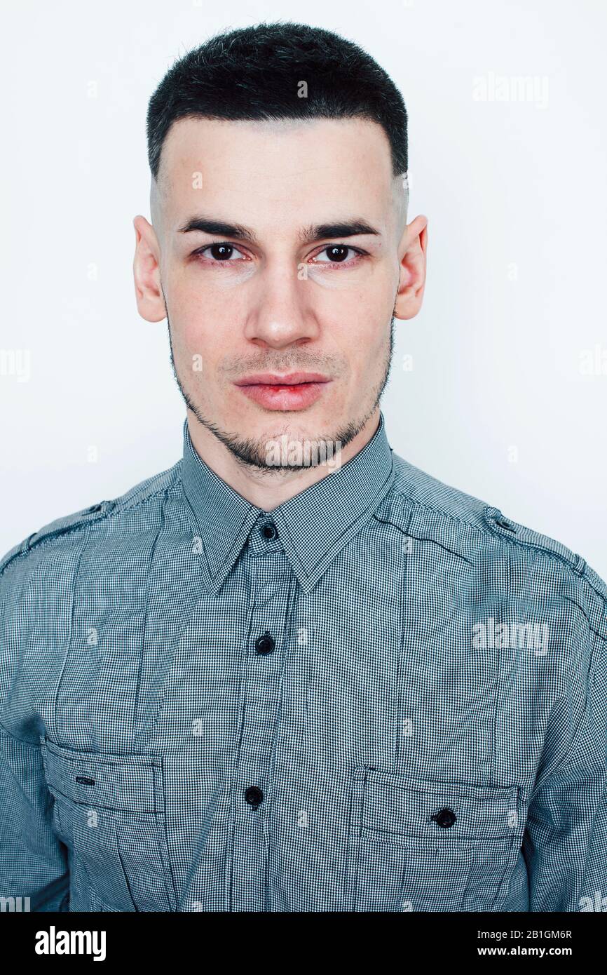 young handsome well groomed guy posing on white background gesturing ...