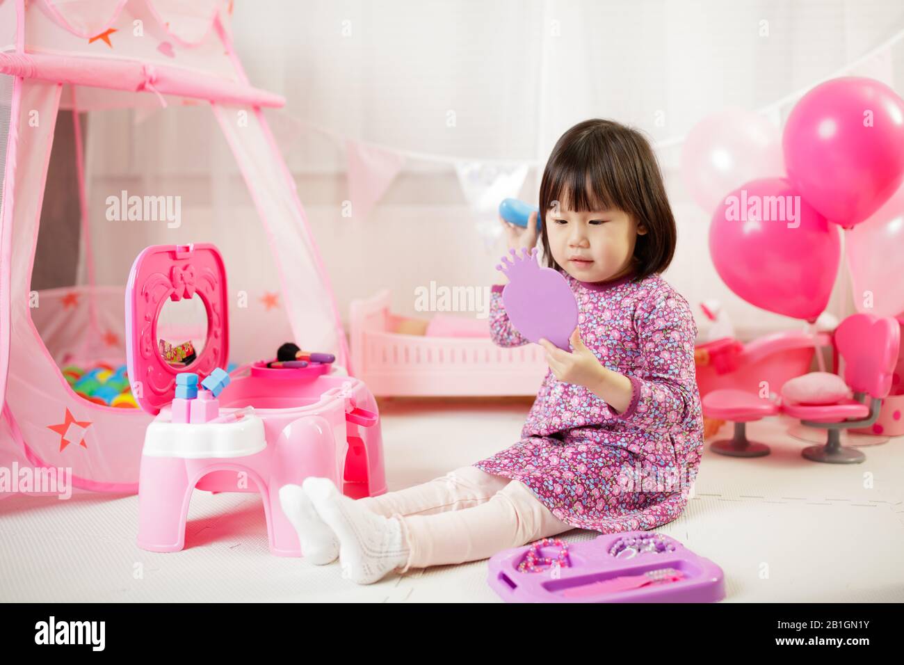 toddler girl pretend play make up at home Stock Photo - Alamy