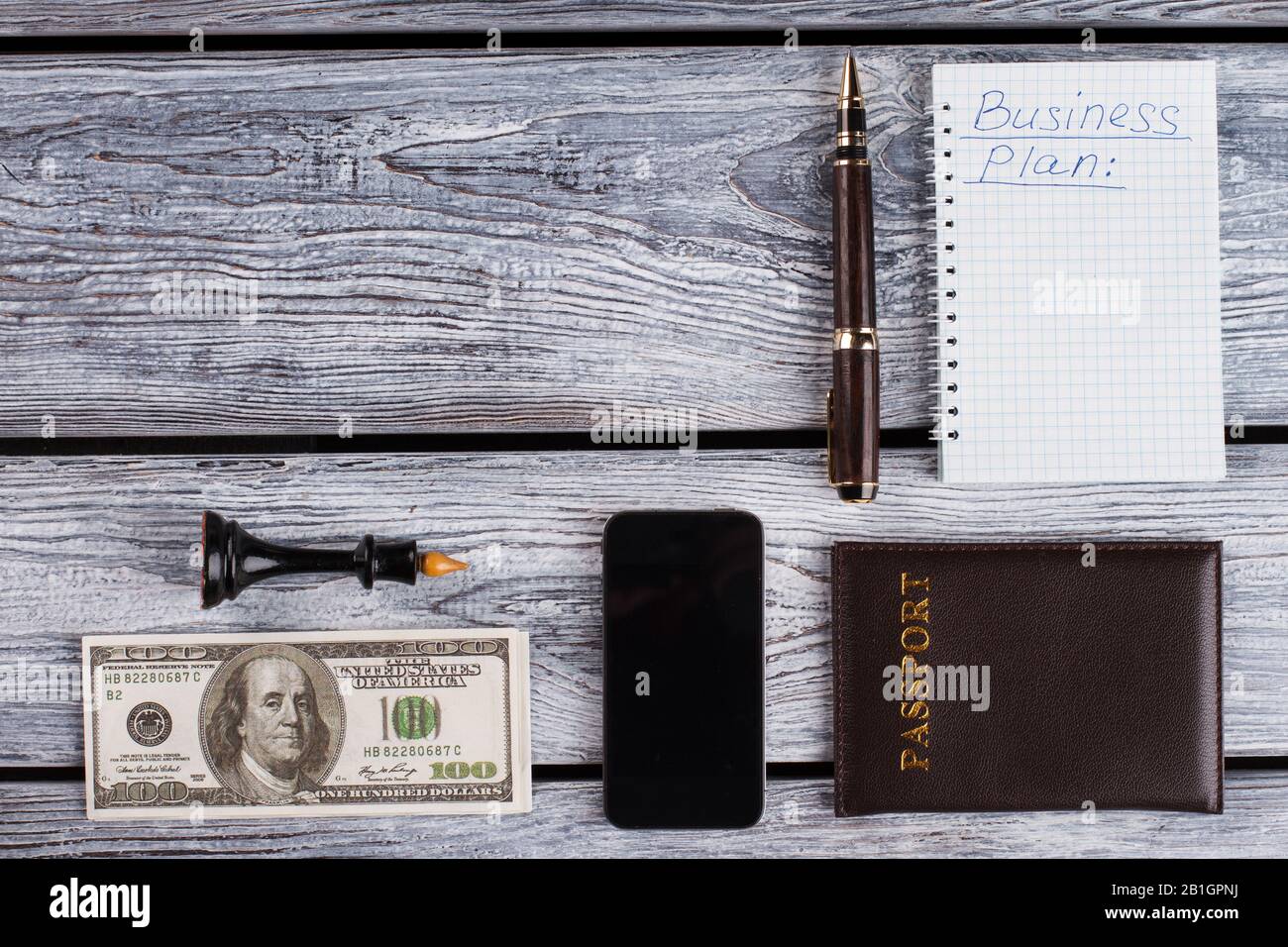 Money, notebook with business plan Stock Photo - Alamy