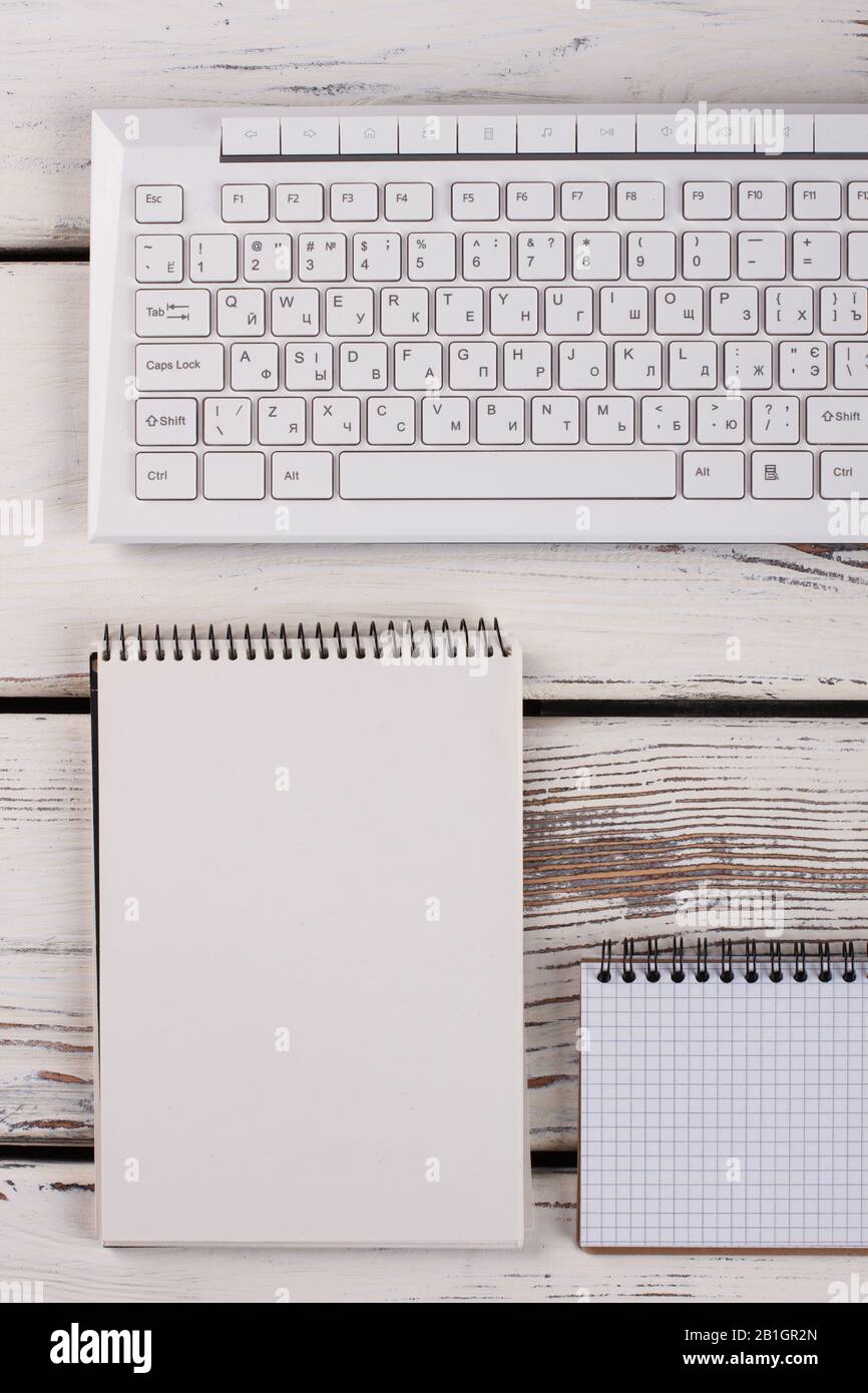 Keyboard and notepads close up Stock Photo - Alamy