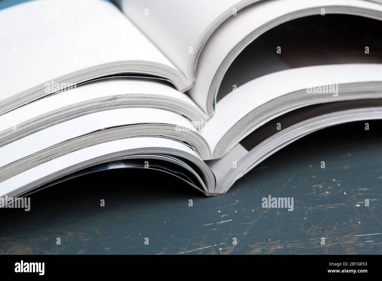 Close up stacking magazine place on table background. Creative photo ...