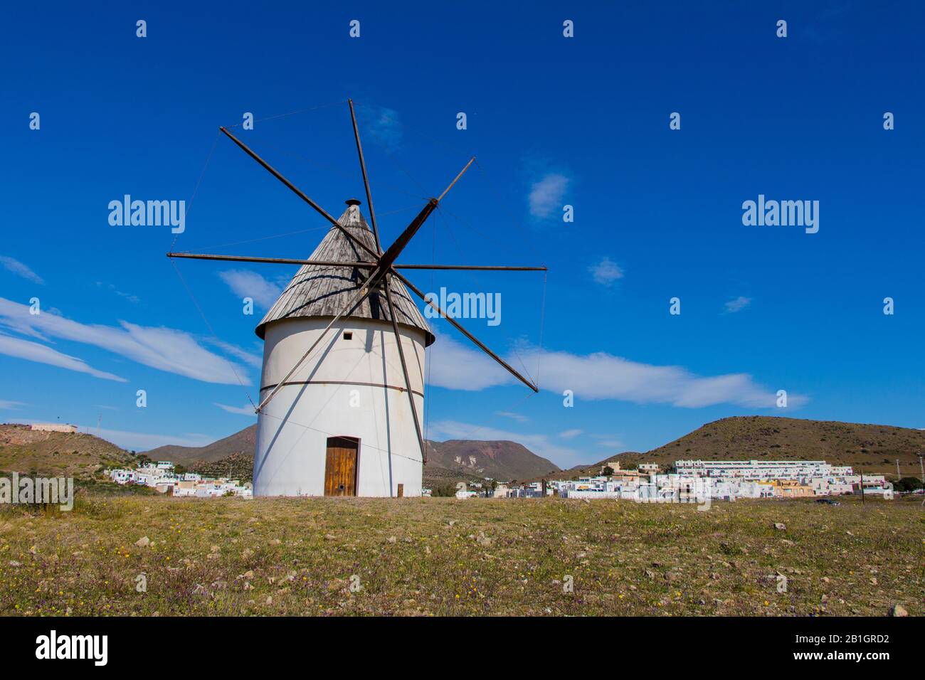 traditional windmill and behind the village of El Pozo de los Frailes ...