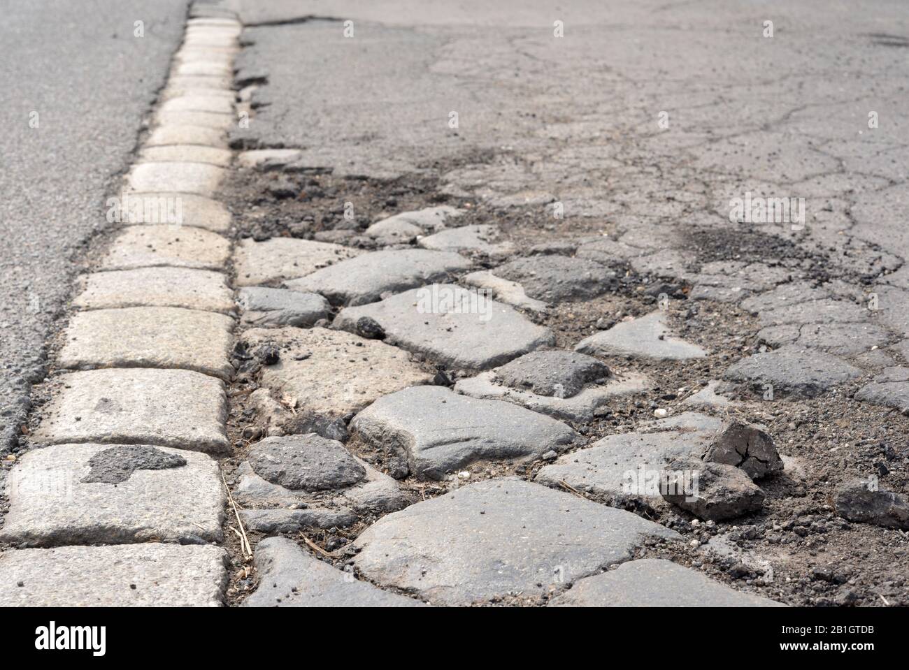Destroyed street texture of stones and asphalt Stock Photo - Alamy