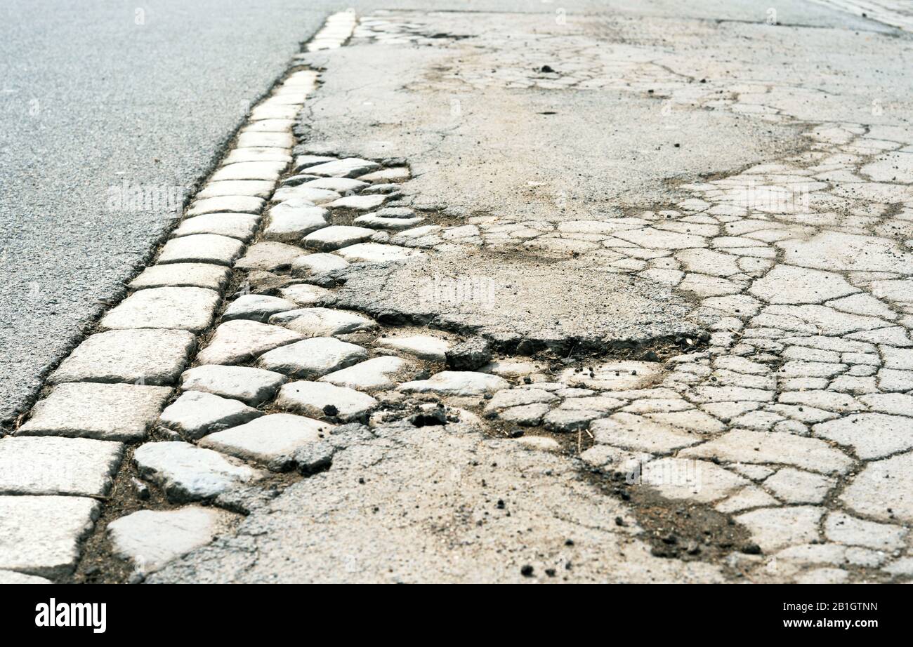 Broken street surface texture with street stones and asphalt Stock ...
