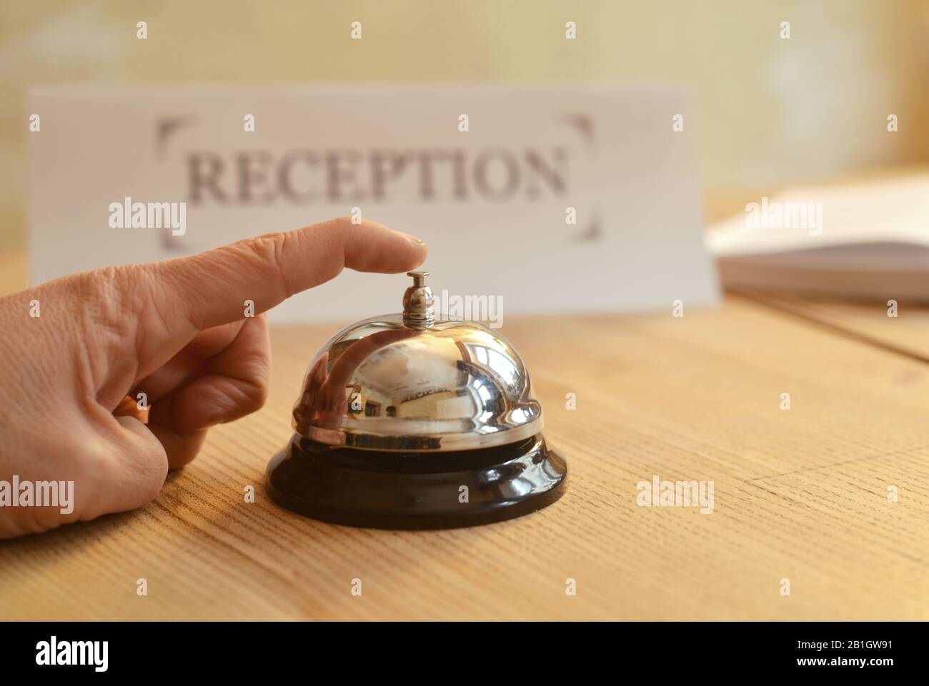 Finger on a bell in a reception, service bell Stock Photo - Alamy
