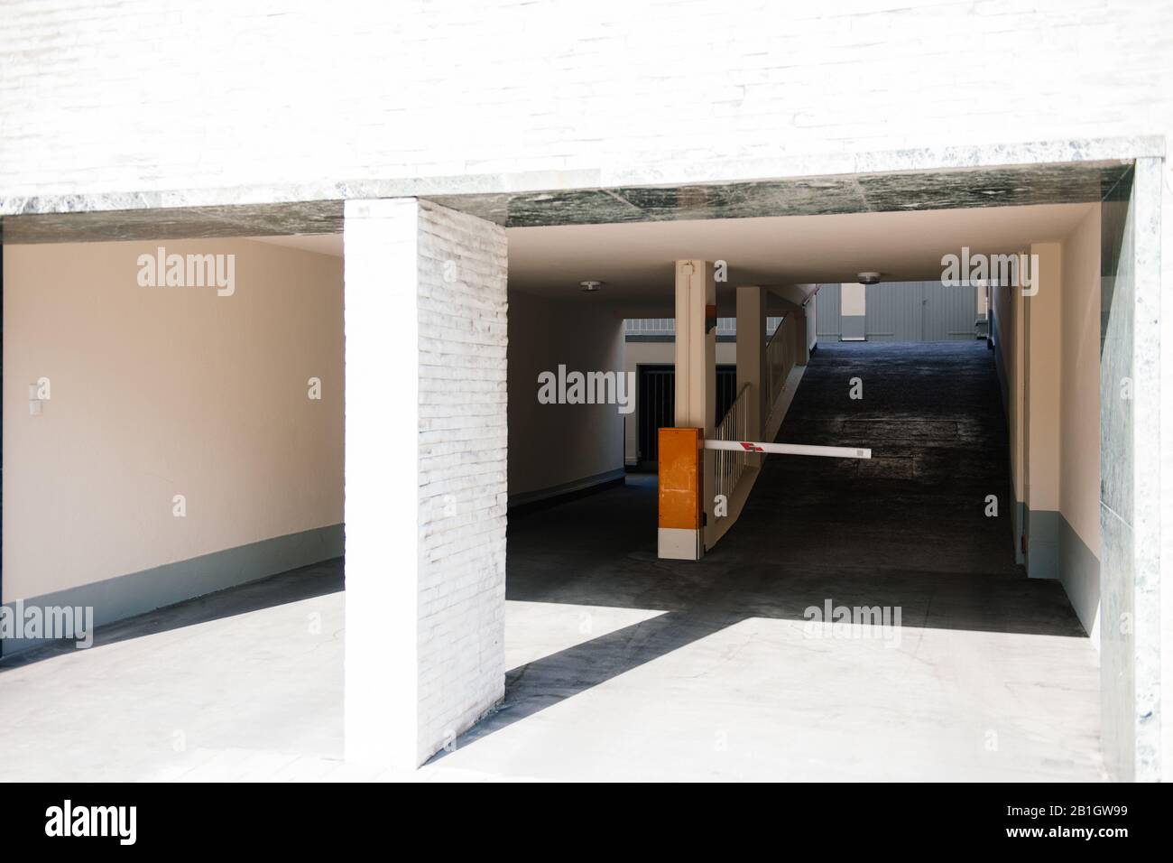 Main entrance to new garage gate with boom barrier entrance to office ...