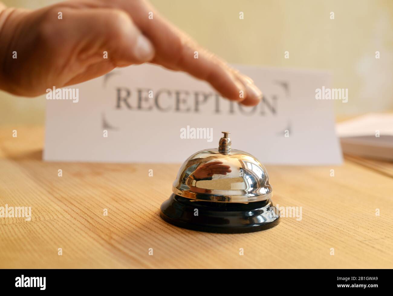 Ring the bell in the reception Stock Photo - Alamy