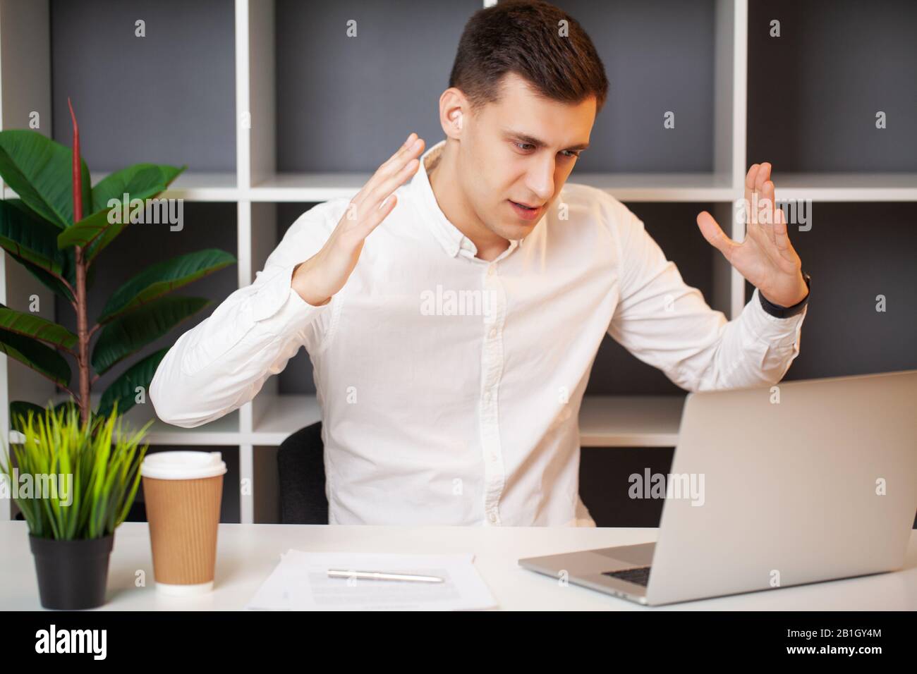 Angry businessman sits desk hi-res stock photography and images - Alamy