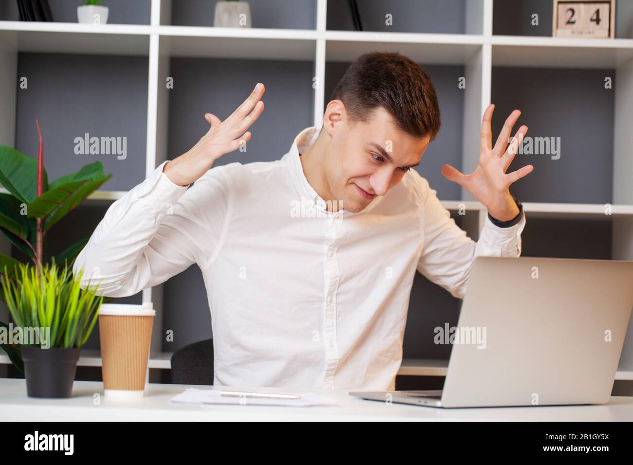 Angry businessman sits desk hi-res stock photography and images - Alamy