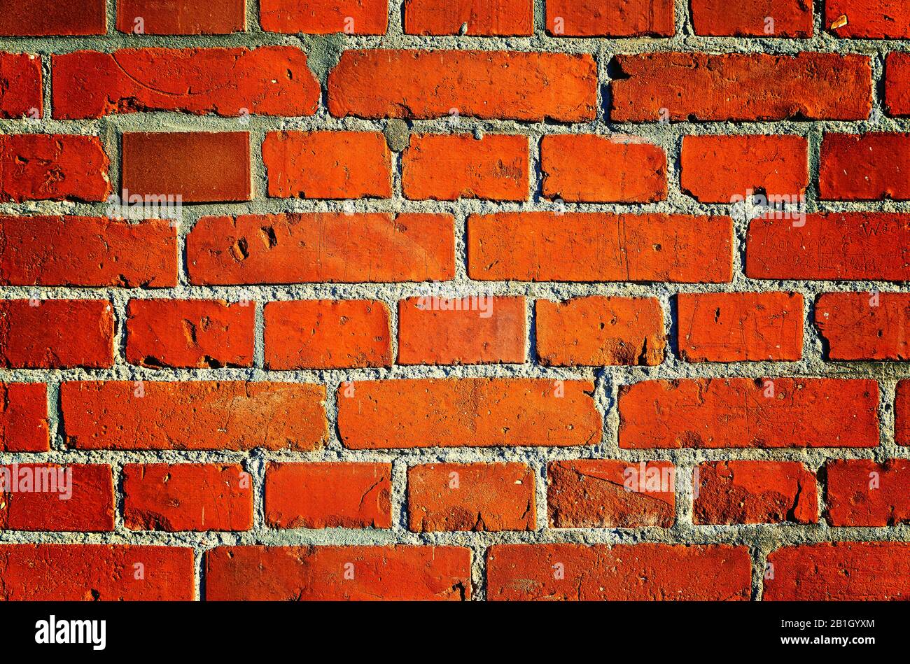 Spot light on an old red brick wall as a background Stock Photo - Alamy