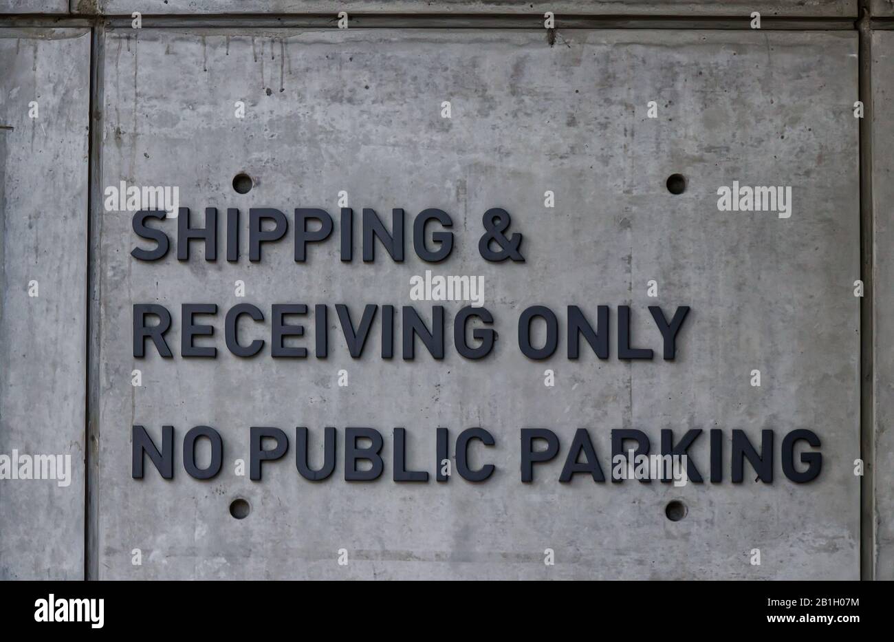 View of sign "Shipping and Receiving Only, No Public Parking" against ...