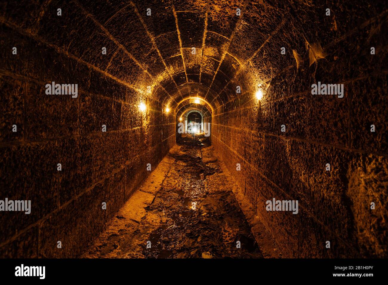 Dark and creepy old historical vaulted flooded underground drainage ...