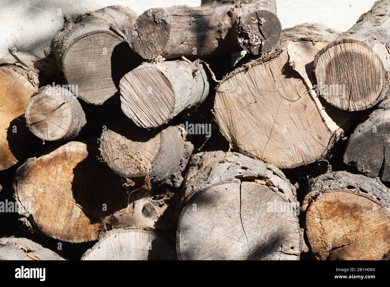 small logs stacked on top of each other Stock Photo - Alamy