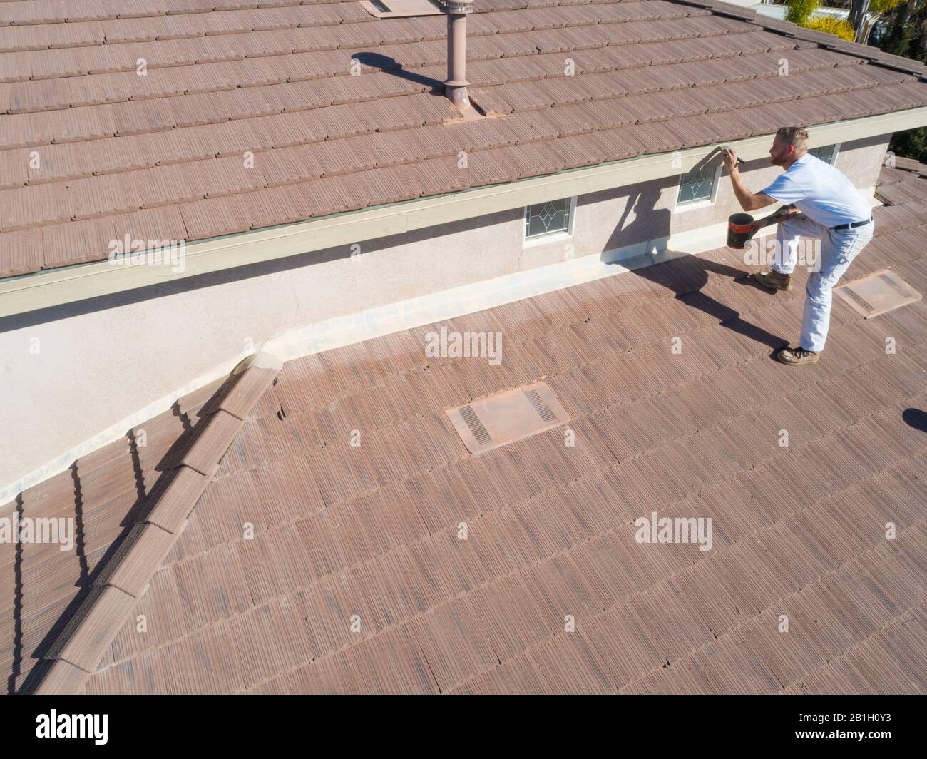 Professional Painter Using A Brush to Paint House Fascia Stock Photo ...