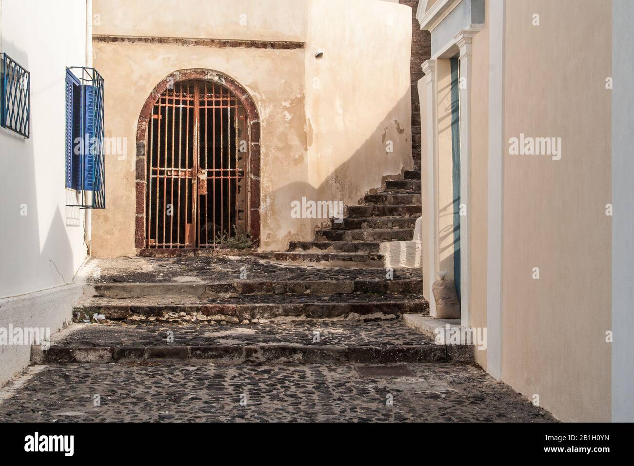 Ancient Cobblestone Walkway and Steps Among Building in Santorini ...