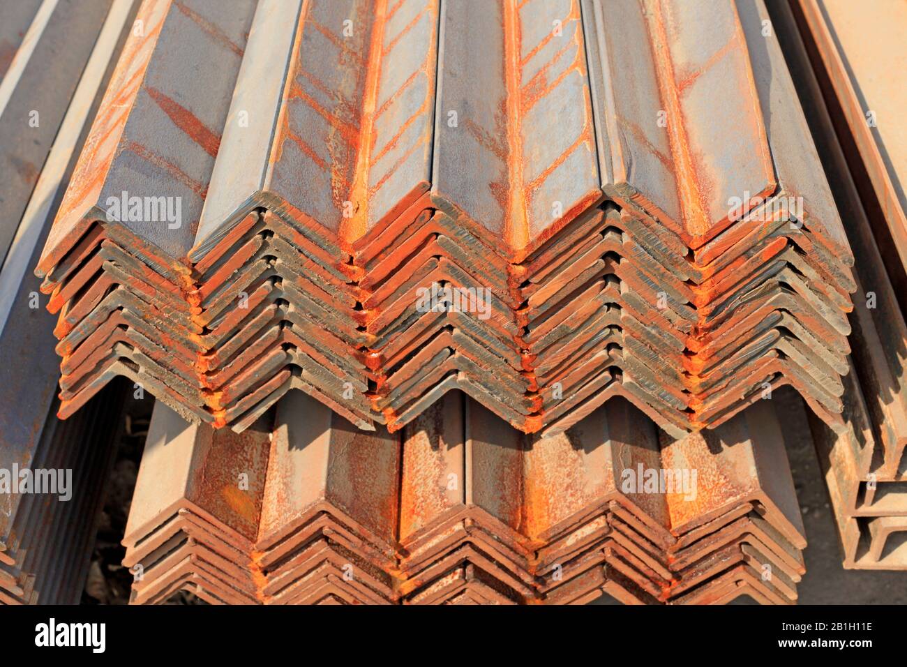 Angle iron piled up together Stock Photo - Alamy