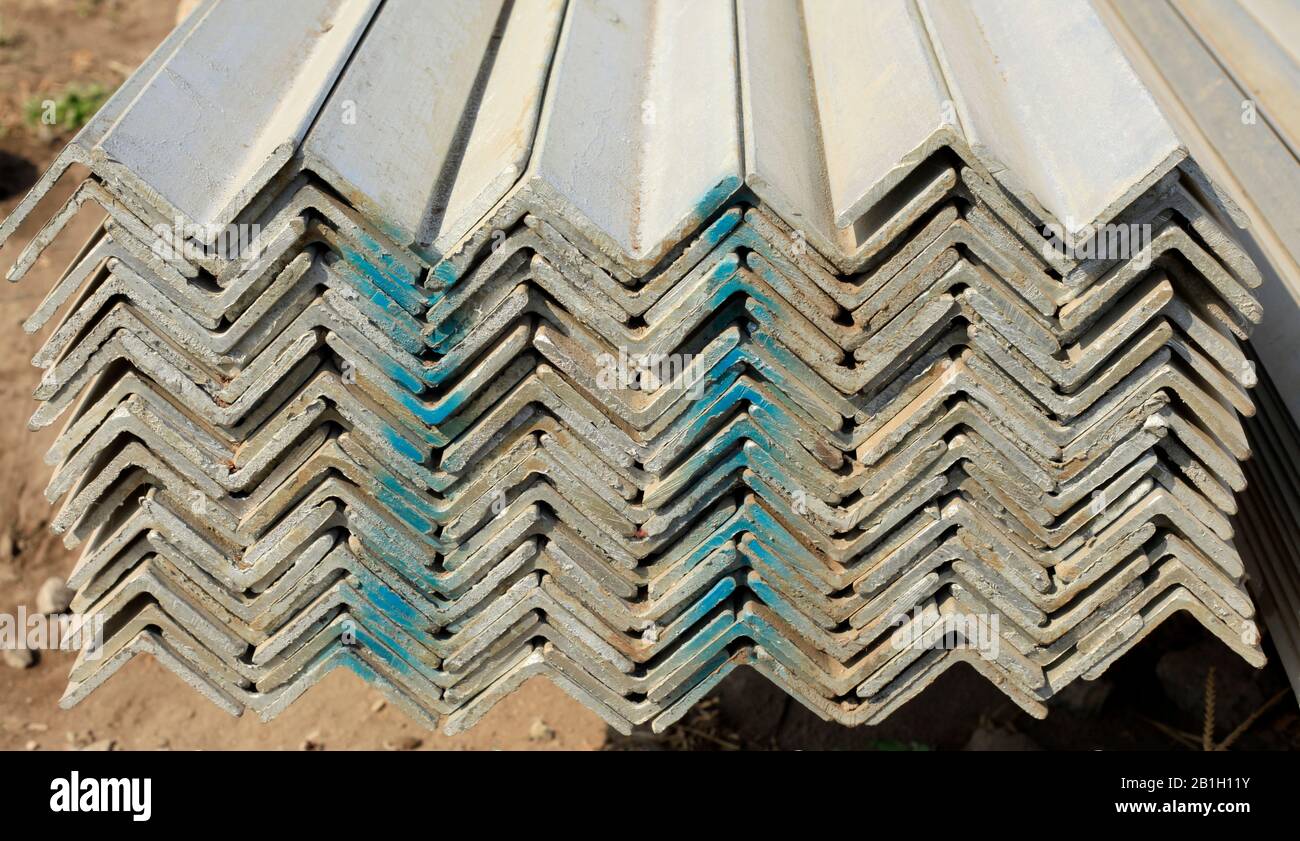 Angle iron piled up together Stock Photo - Alamy