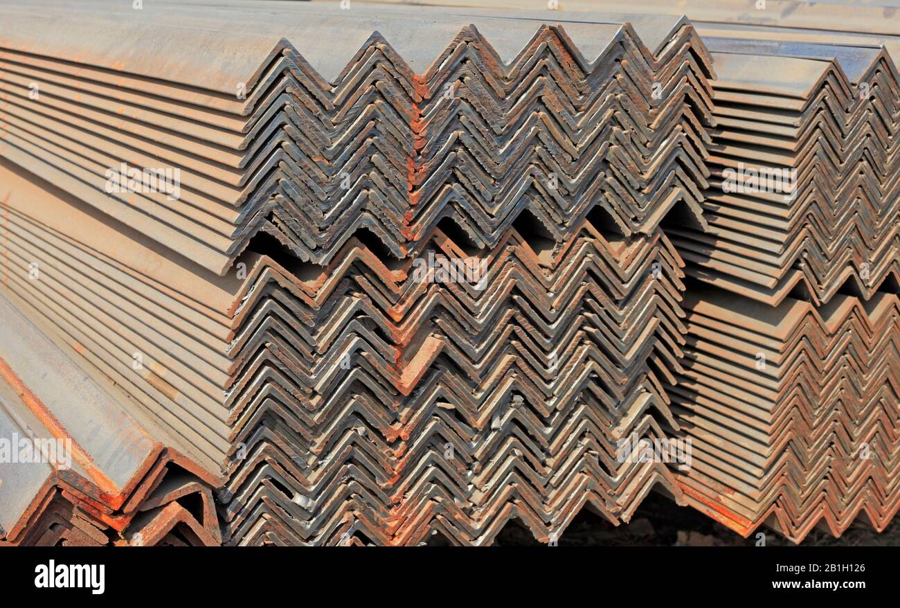 Angle iron piled up together Stock Photo - Alamy