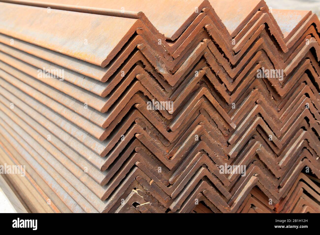 Angle iron piled up together Stock Photo - Alamy