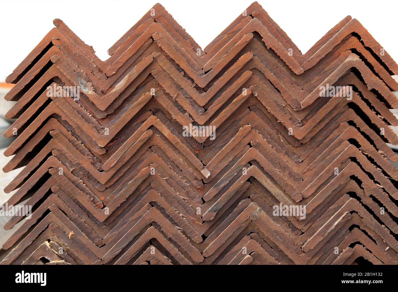 Angle iron piled up together Stock Photo - Alamy