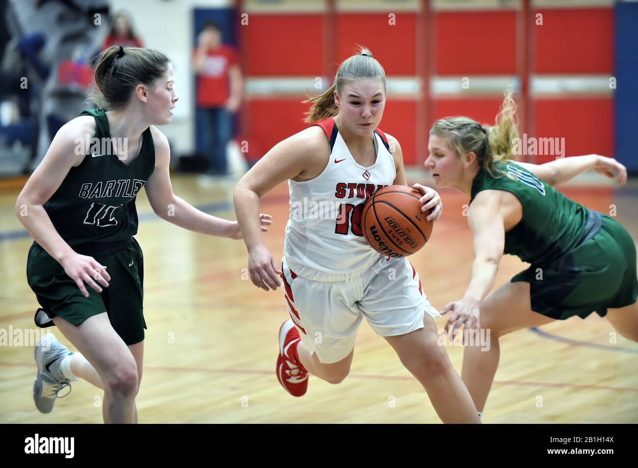 Guard attempting drive between a pair of defending opponents. USA Stock ...