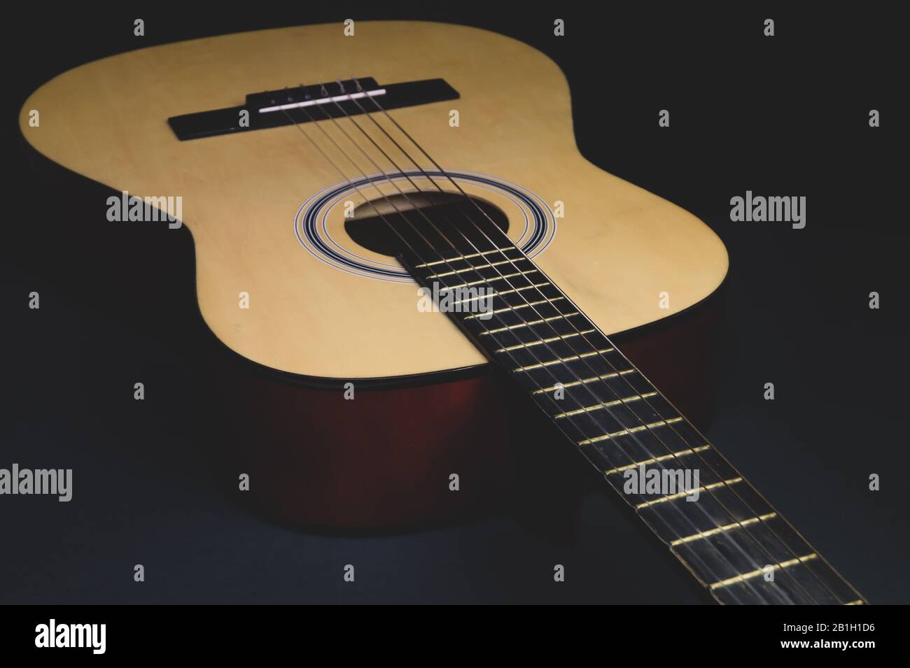 Guitar on the black background. acoustic musical instrument Stock Photo ...