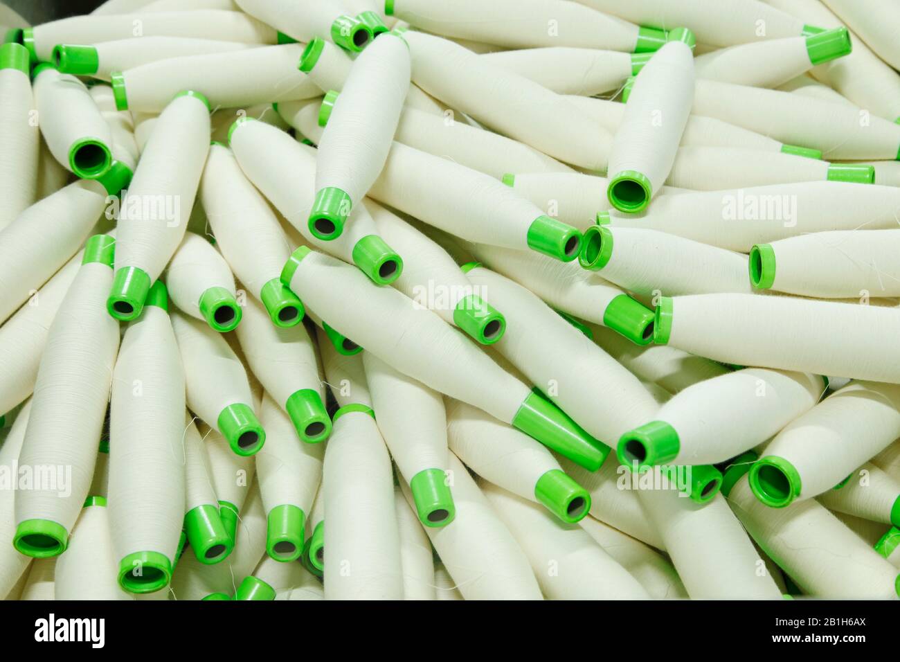The textile workshop, spool piled up together, neat rows Stock Photo ...
