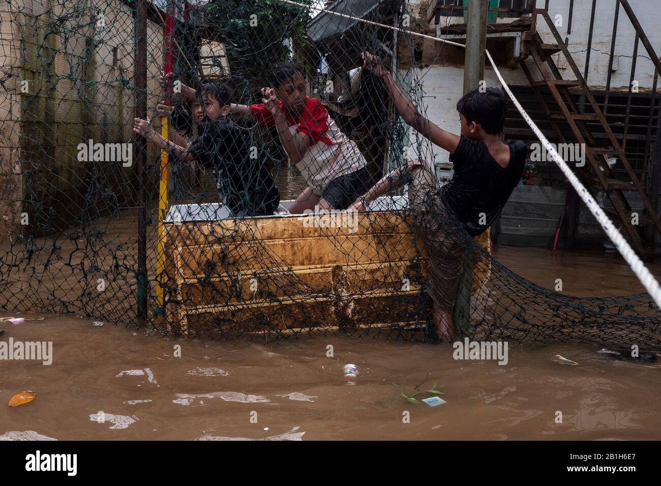 Kids playing in the flooded water.Heavy rains triggered widespread ...