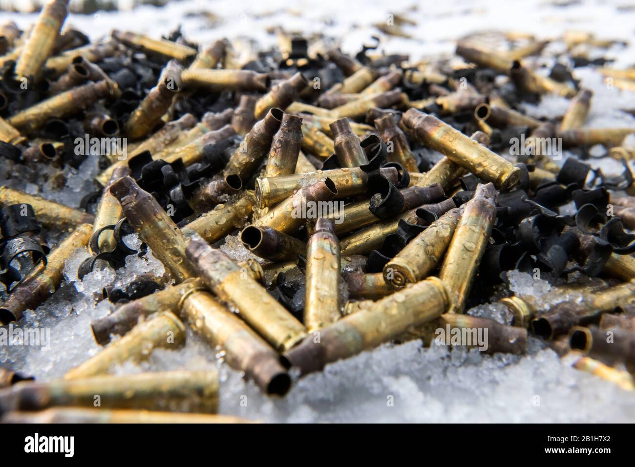 Expended 5.56 mm ammunition casings litter the ground as paratroopers ...
