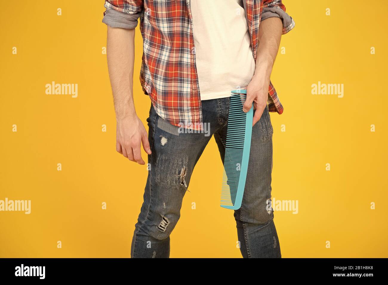 Professional equipment. Combing hair. Male hand hold comb. Hairdresser ...