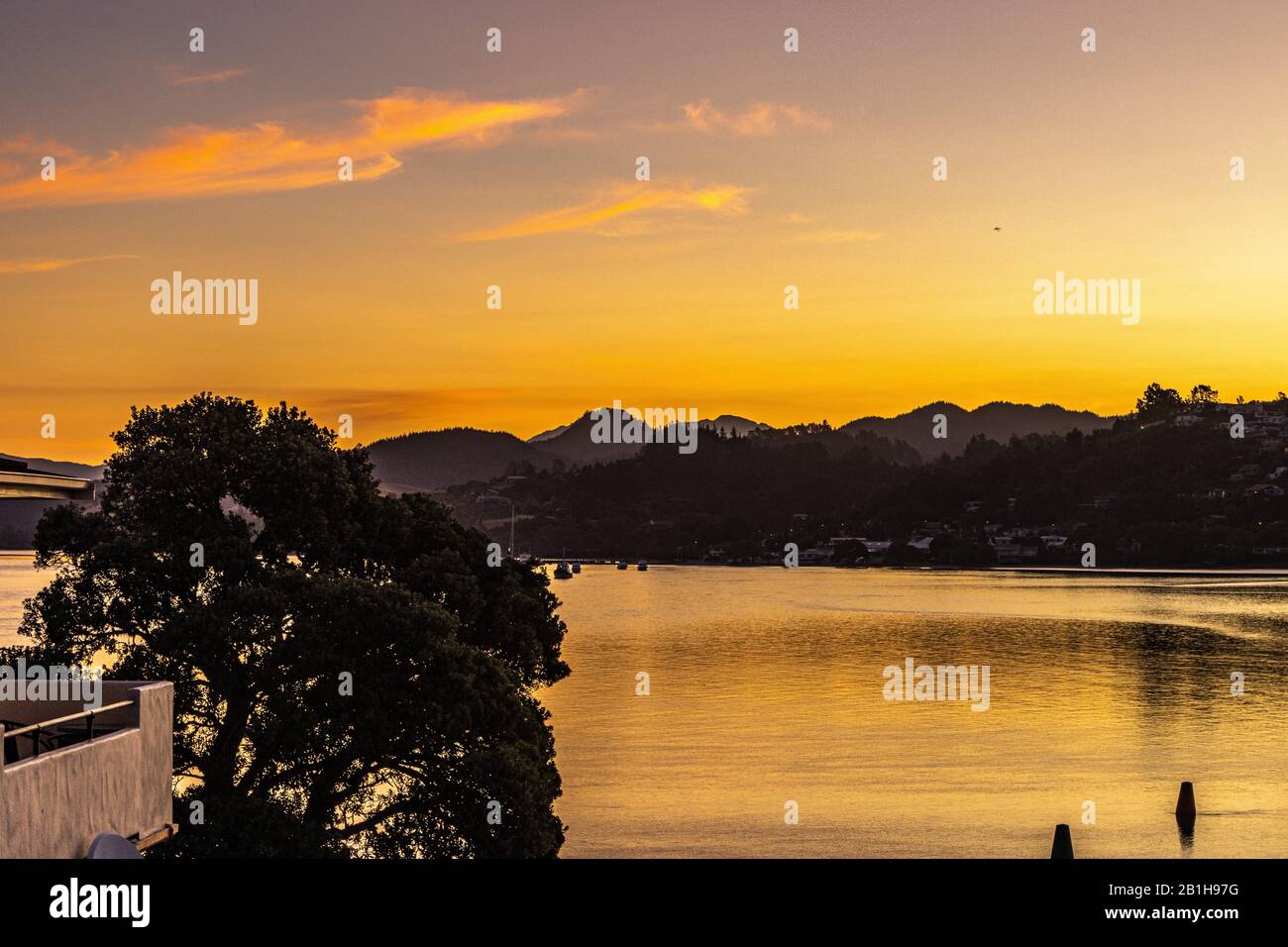 Sunset over inlet at Tairua on the Coromandel Pensinsula, New Zealand ...