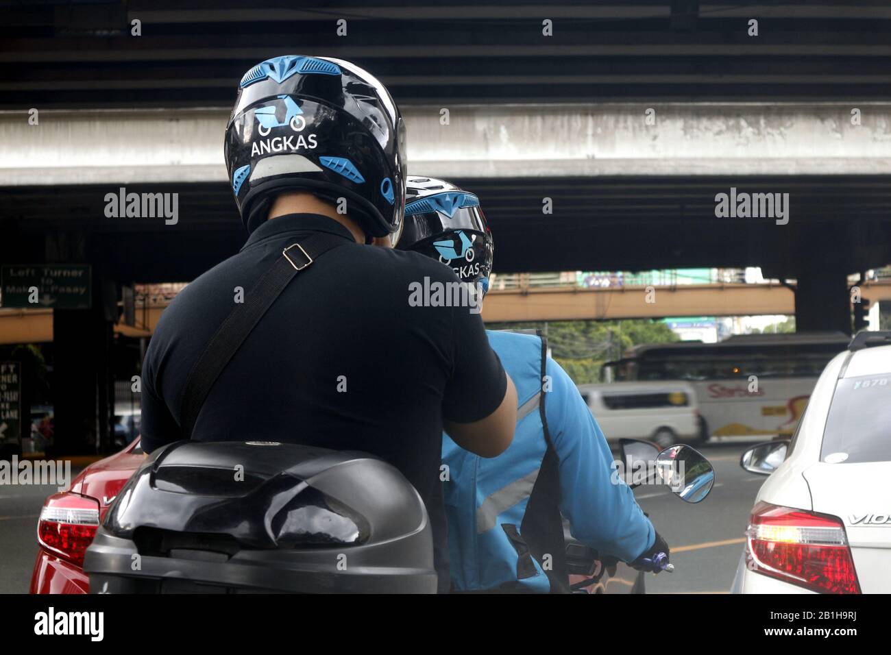 Quezon City, Philippines - February 17, 2020: Motorcycle taxi driver ...