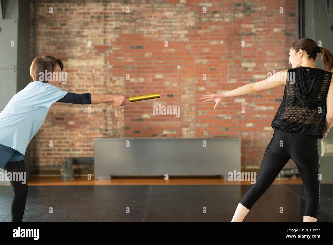 Passing baton over generations Stock Photo - Alamy