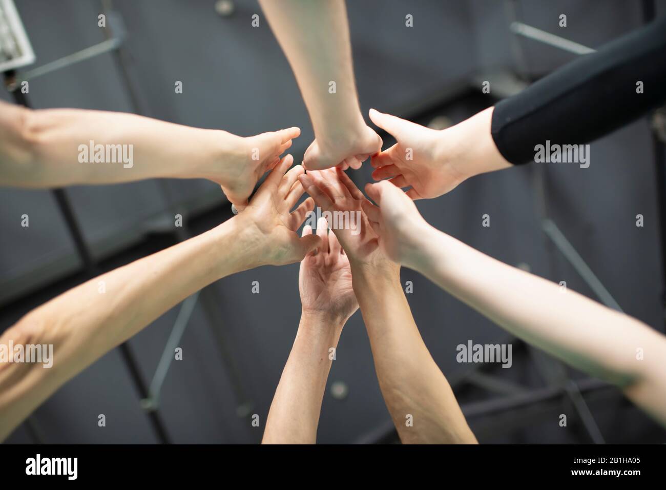 Hands putting together Stock Photo - Alamy