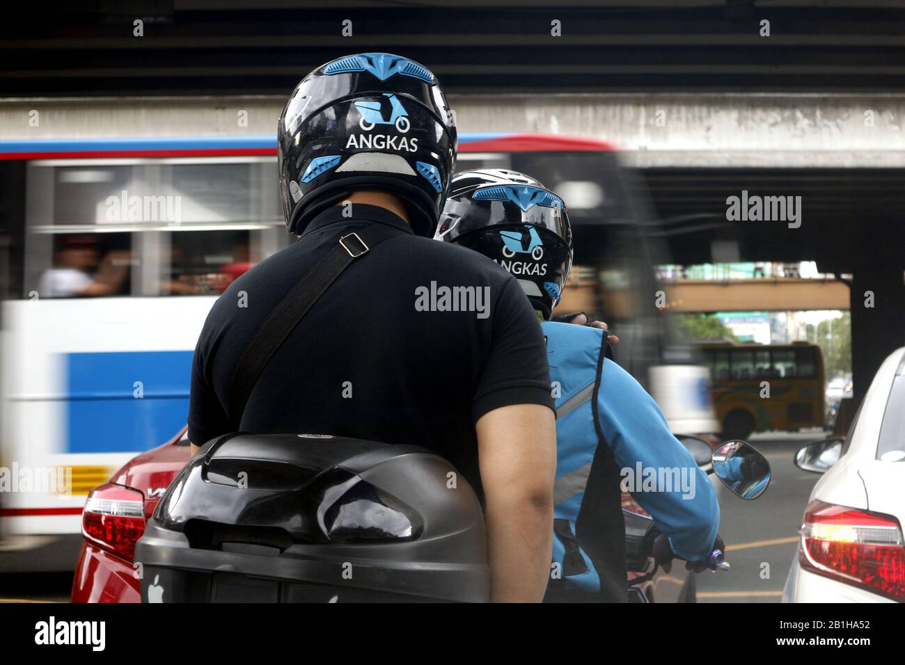 Quezon City, Philippines - February 17, 2020: Motorcycle taxi driver ...