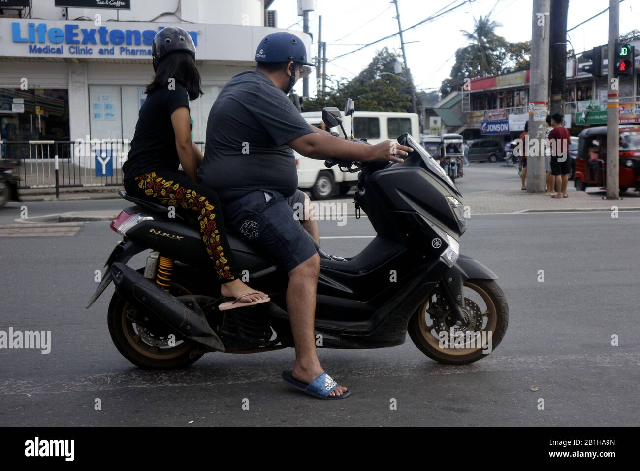 Quezon City, Philippines - February 17, 2020: Motorcycle driver and his ...