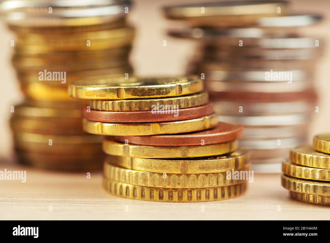 piles of coins on working table. creative photo Stock Photo - Alamy
