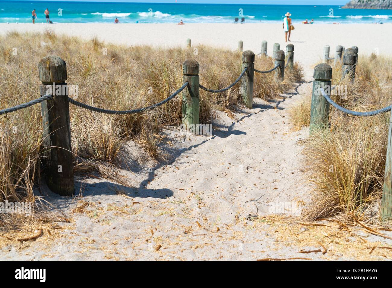 Beach access between rope and bollards across sand path at main beach ...