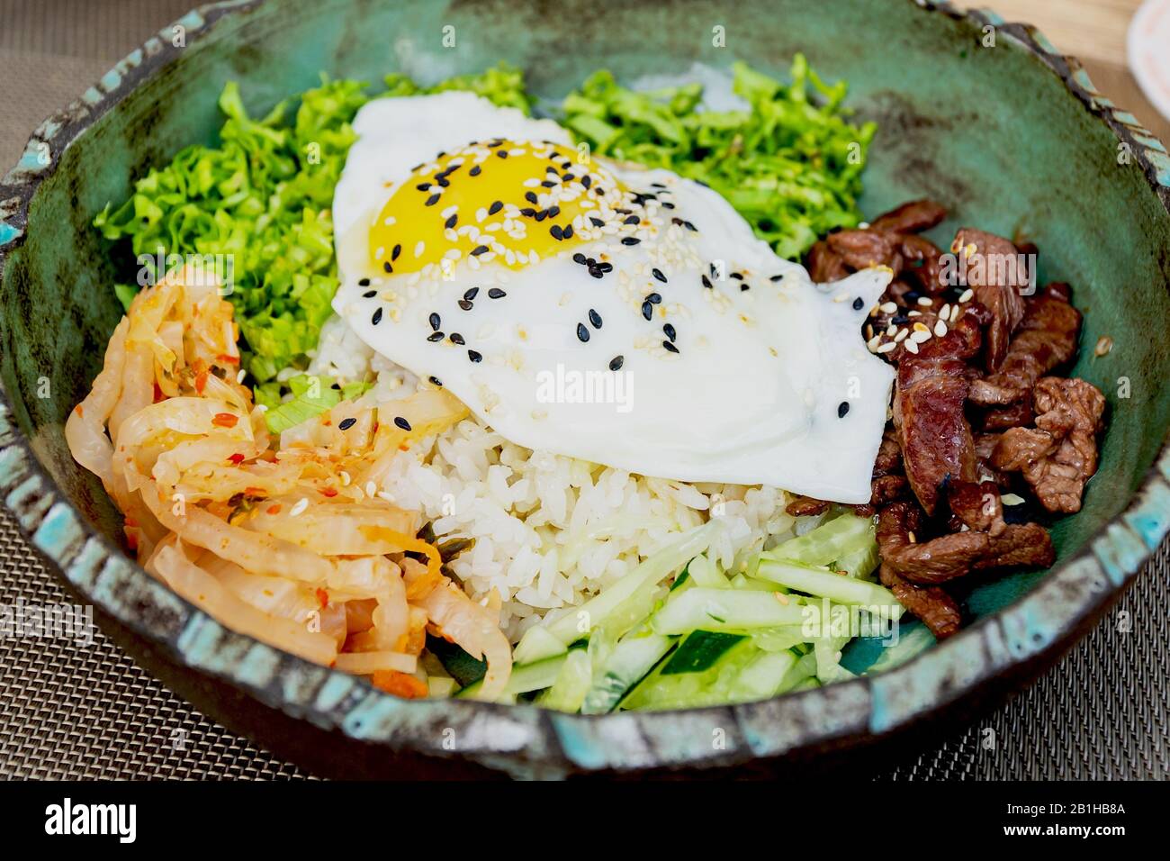 Korean bibimbap rice, a traditional food of Korea top up with meat and ...