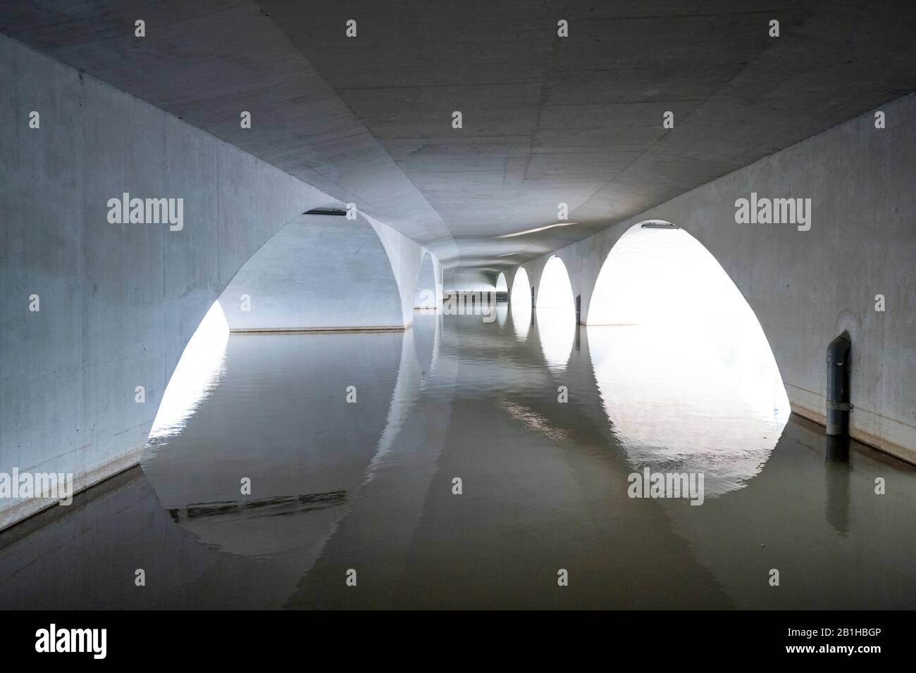 Curved Concrete Bridge over the water Stock Photo - Alamy