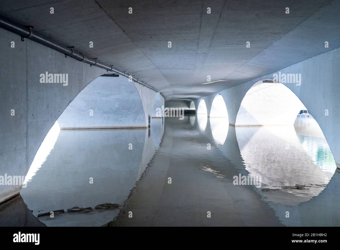 Curved Concrete Bridge over the water Stock Photo - Alamy
