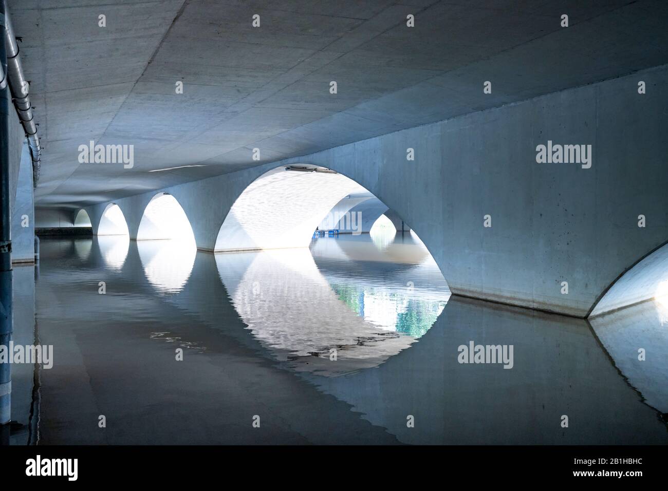 Curved Concrete Bridge over the water Stock Photo - Alamy